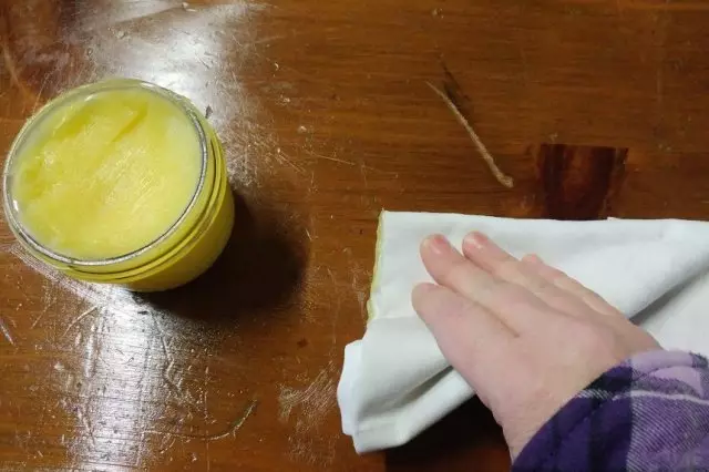 Polishing wax furniture.