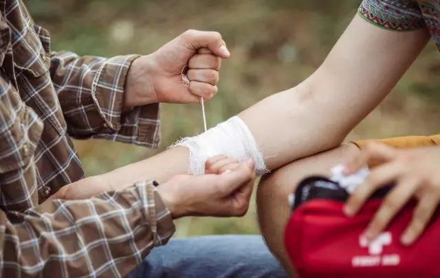 first-aid kit hand tie bandage wound photo