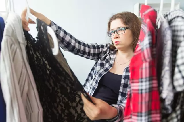 Woman chooses clothes