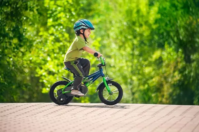 Boy rides a bike